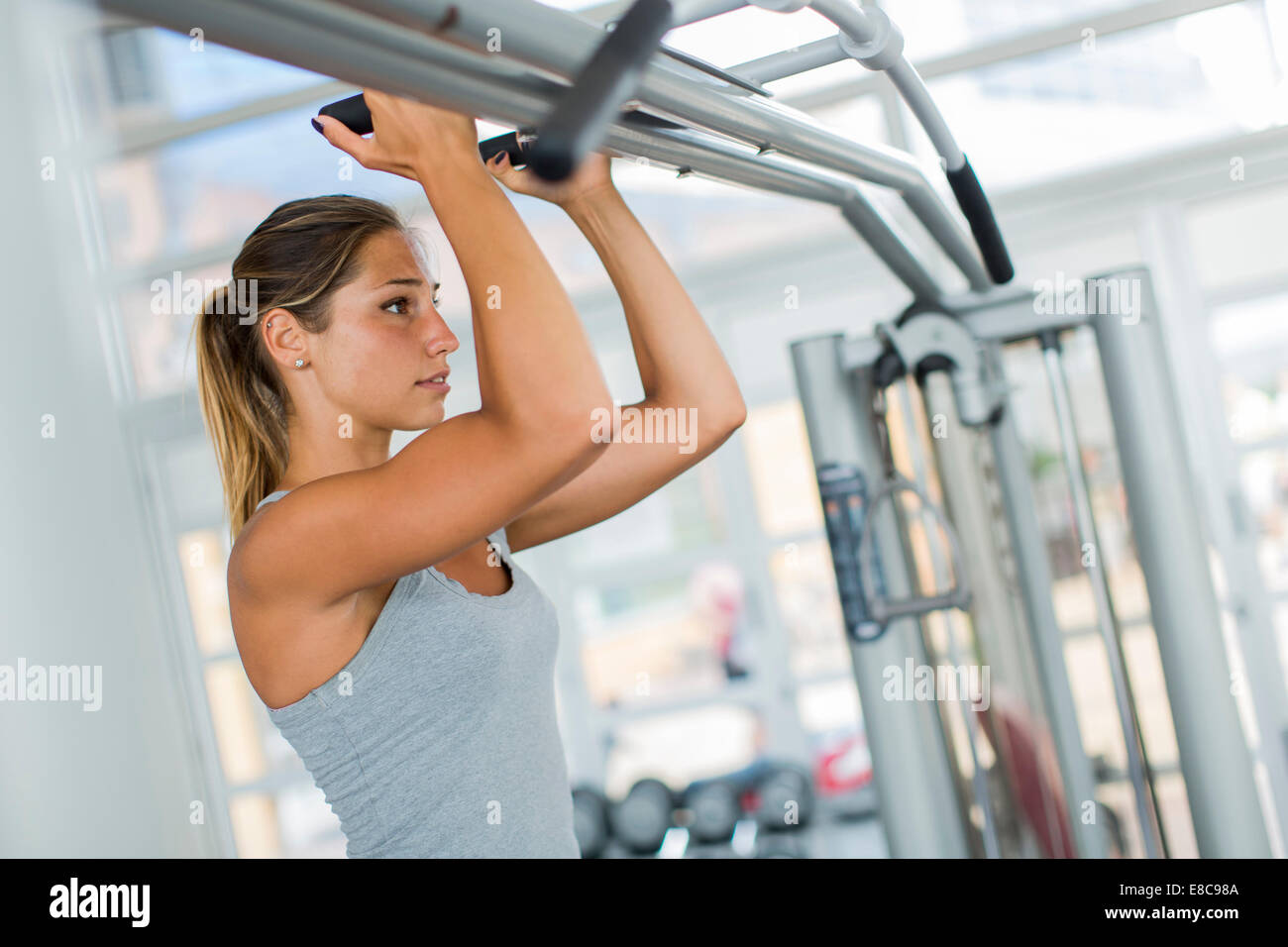 Pretty young woman training in the gym Stock Photo - Alamy