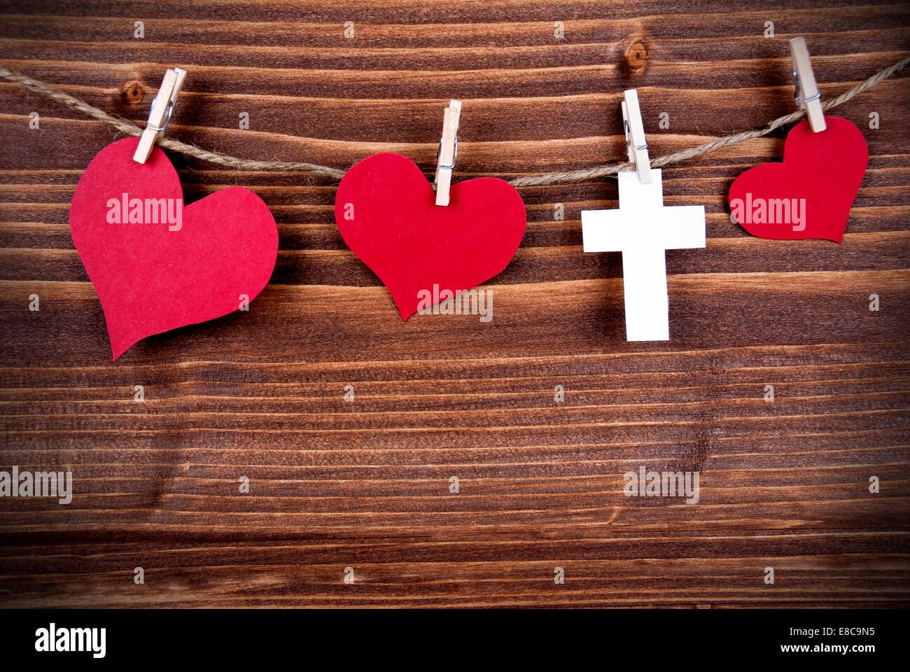 Red heart with cross sign hi-res stock photography and images - Alamy
