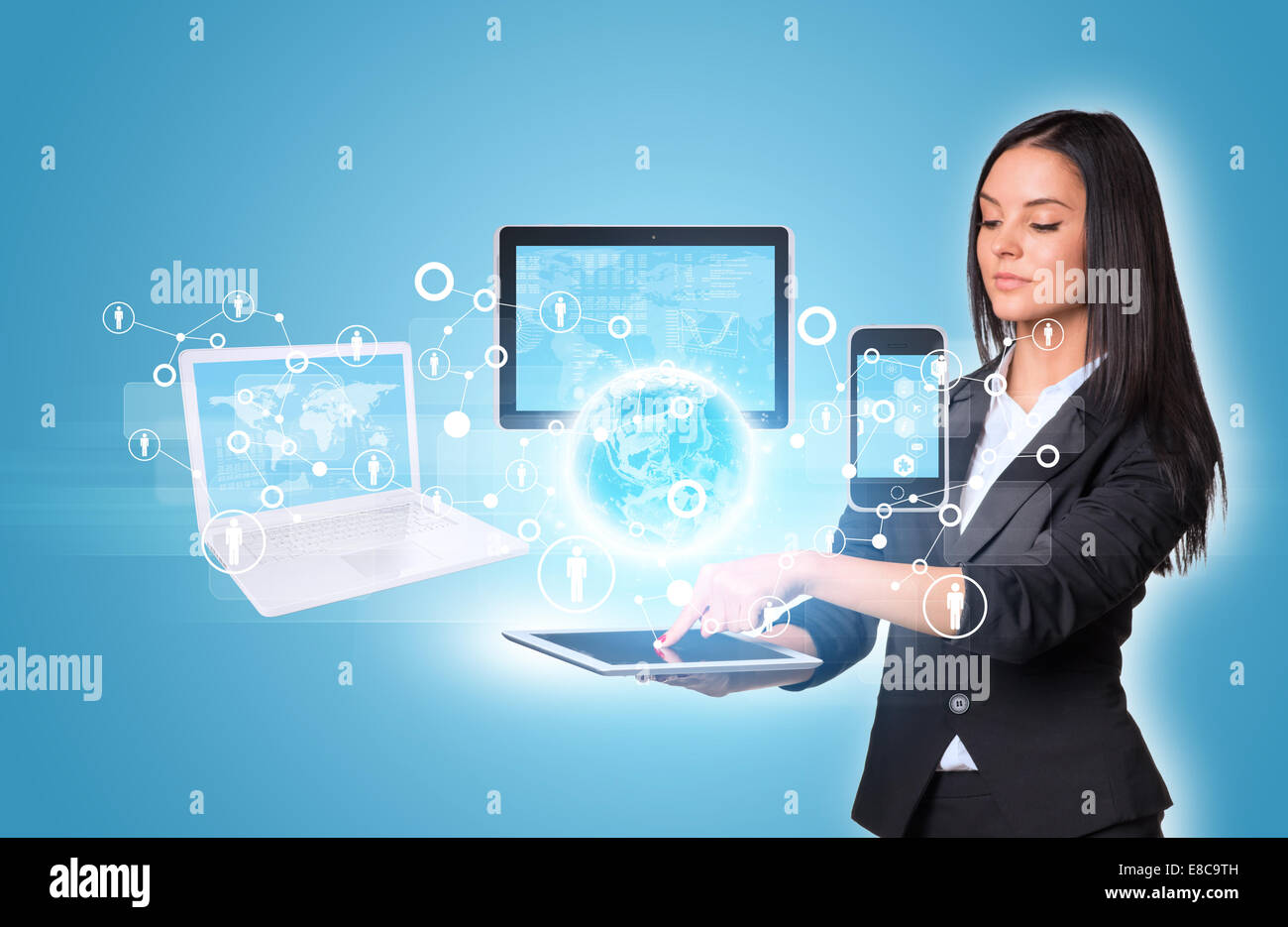 Women using digital tablet and Earth with electronics Stock Photo - Alamy