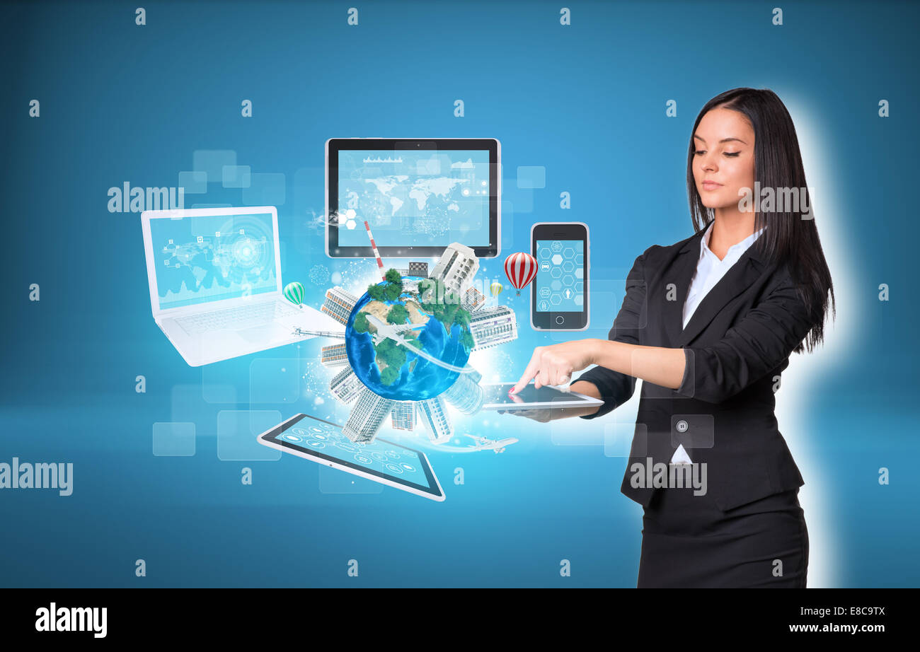 Women using digital tablet and Earth with electronics Stock Photo - Alamy