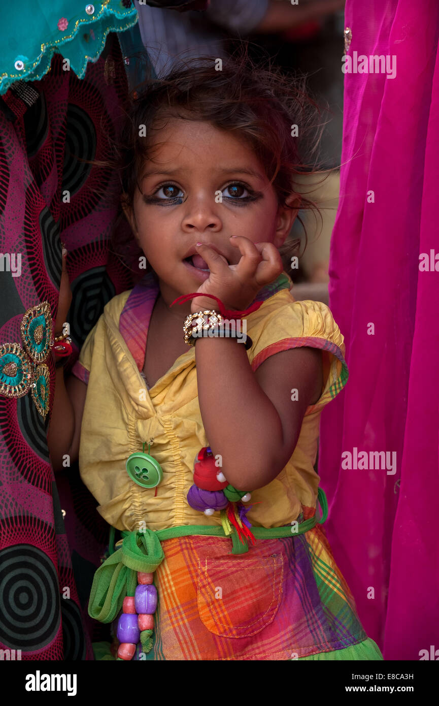 Incredible beautiful big eyes. Little Indian girl in colorful ...