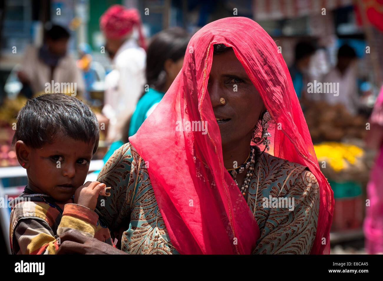 Rural Life in Rajasthan, Woman in traditional colored clothes with her ...