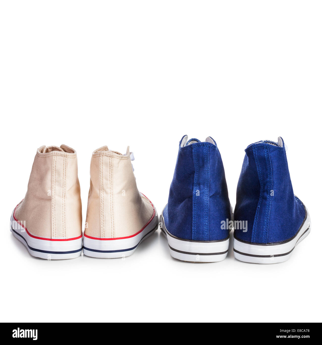 Two pairs of sport shoes isolated on white background. Rear view ...