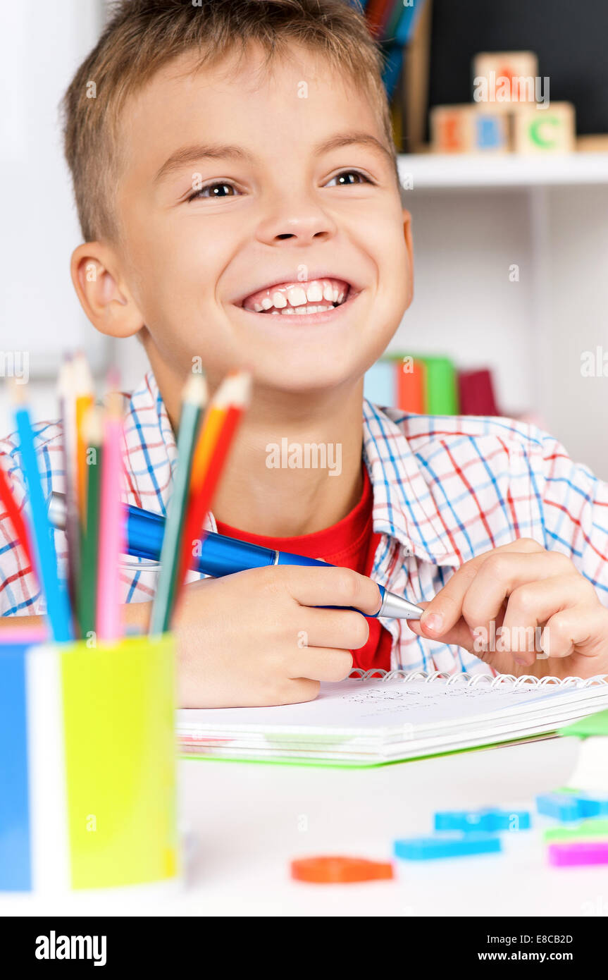 Boy doing homework Stock Photo - Alamy