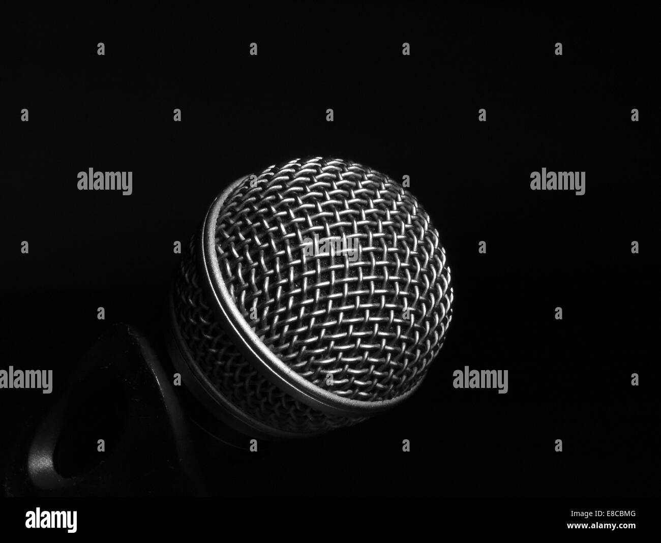 Silver microphone on a black background Stock Photo - Alamy