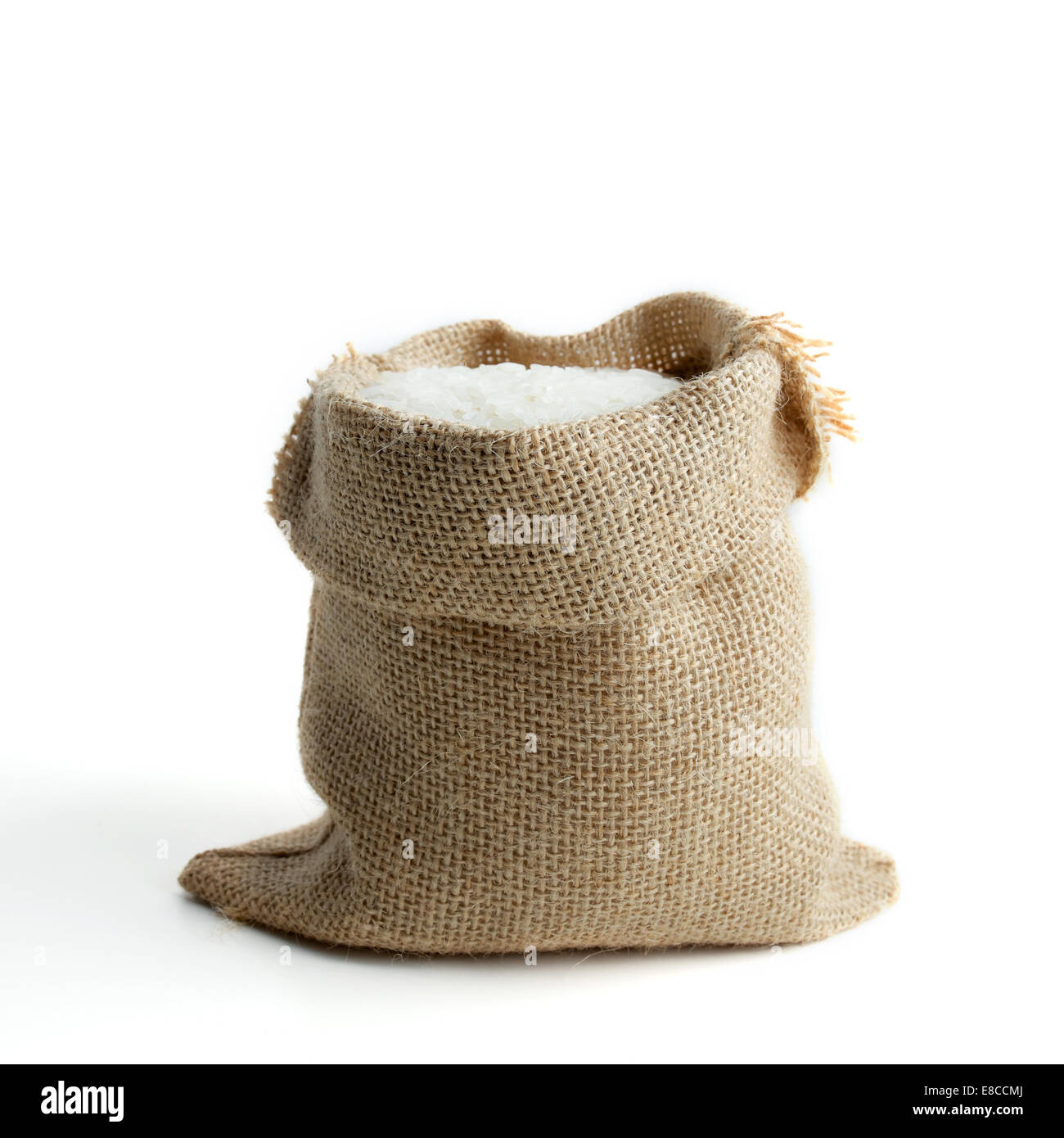 White rice in burlap sack Cut Out Stock Images & Pictures - Alamy