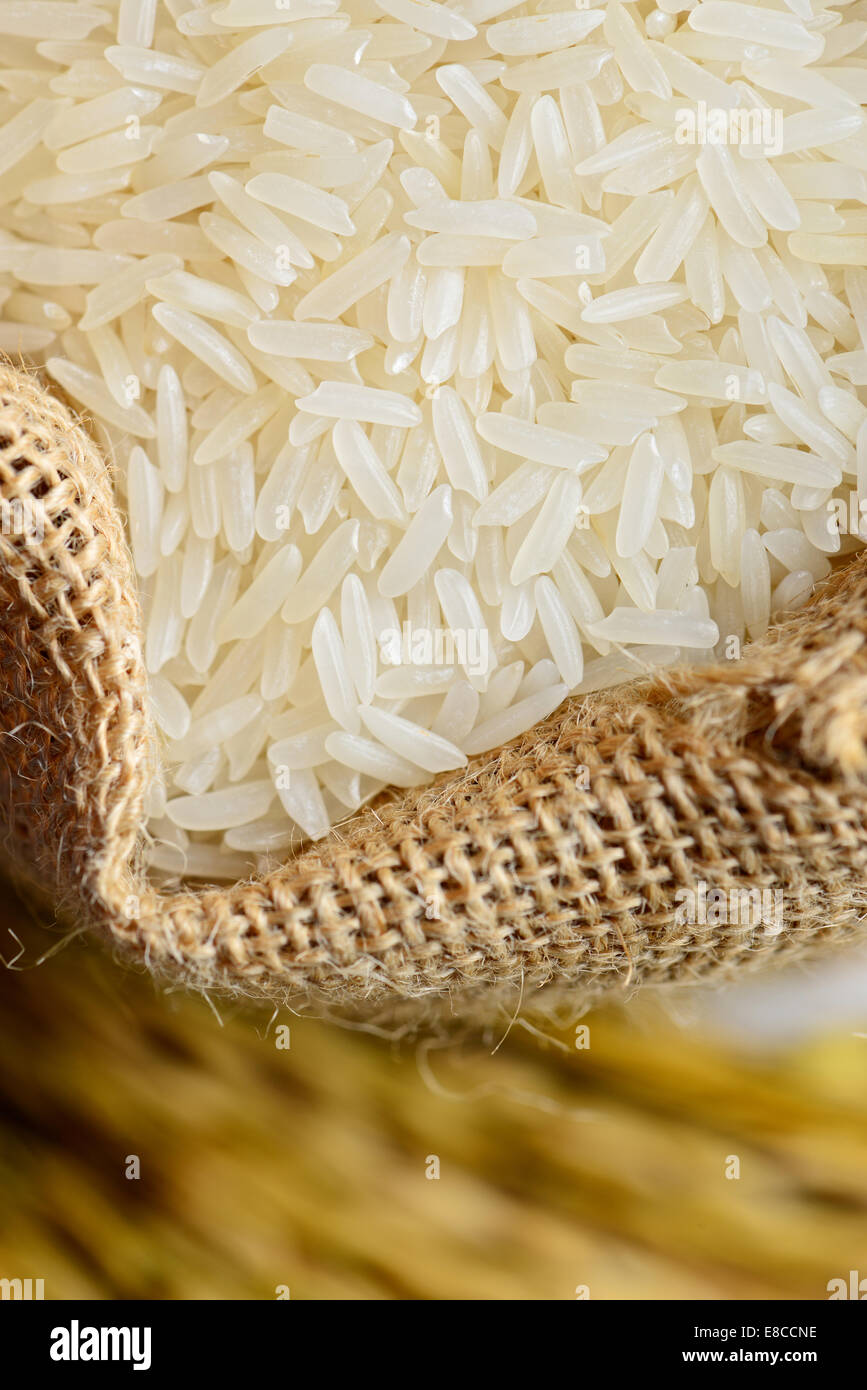 white rice in burlap sack Stock Photo - Alamy