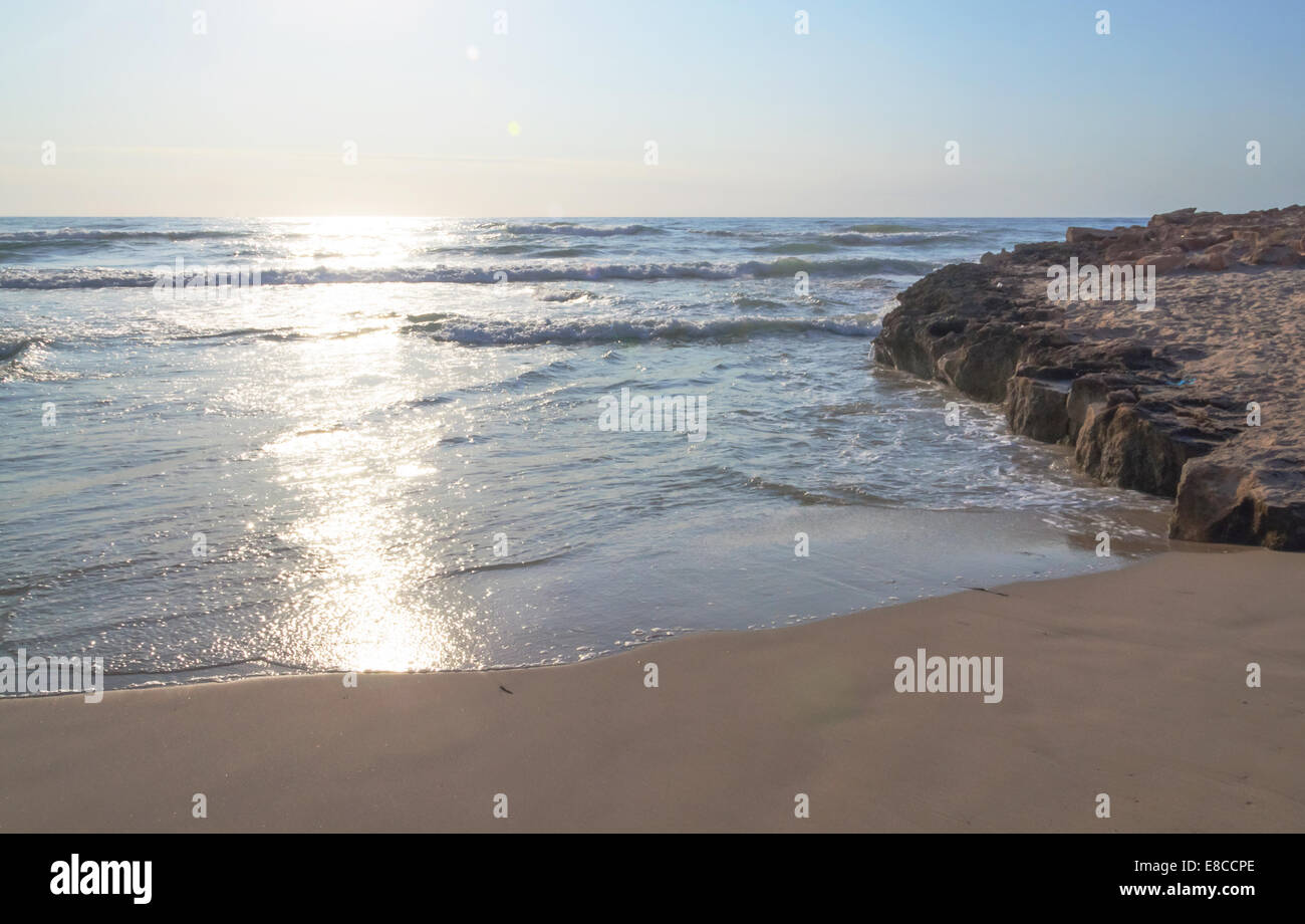 Beach scene on a windy day with scirocco winds, bringing red sand from ...