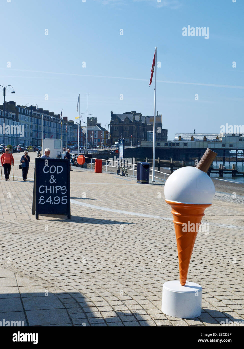 Large plastic ice-cream with cod & chips advert on the promenade in ...