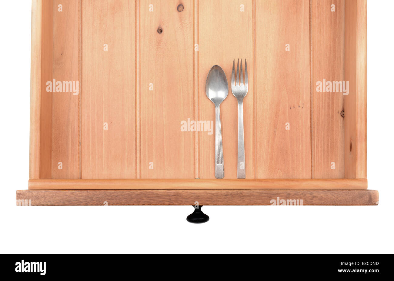 High angle of an open kitchen drawer with only a spoon and fork inside ...