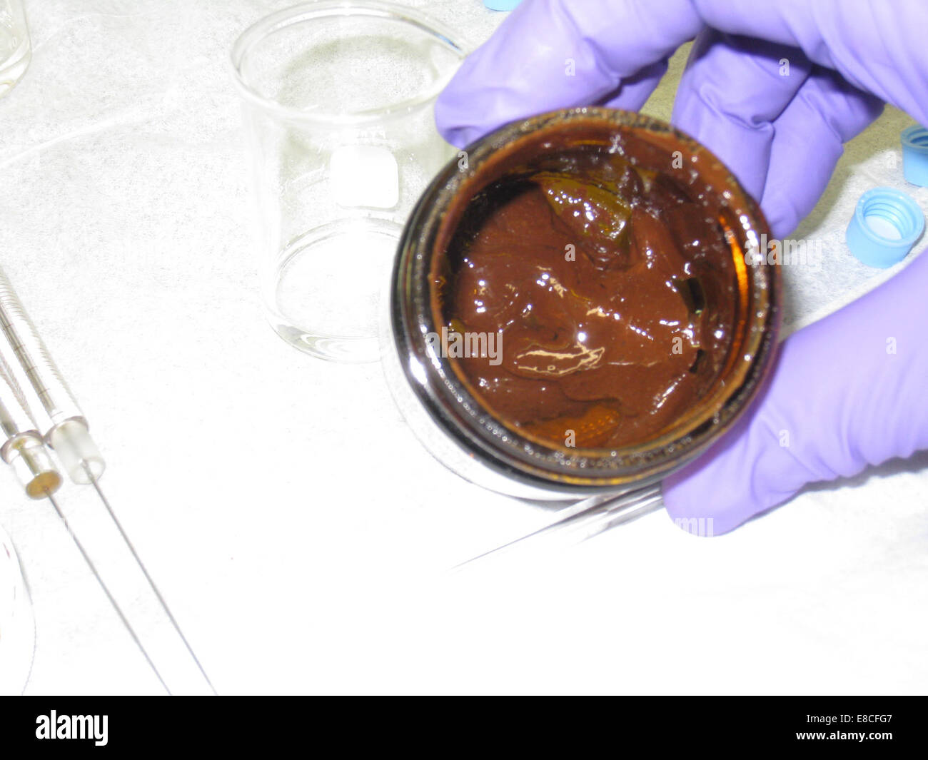 This image documents the collection of oil spill samples, which are ...