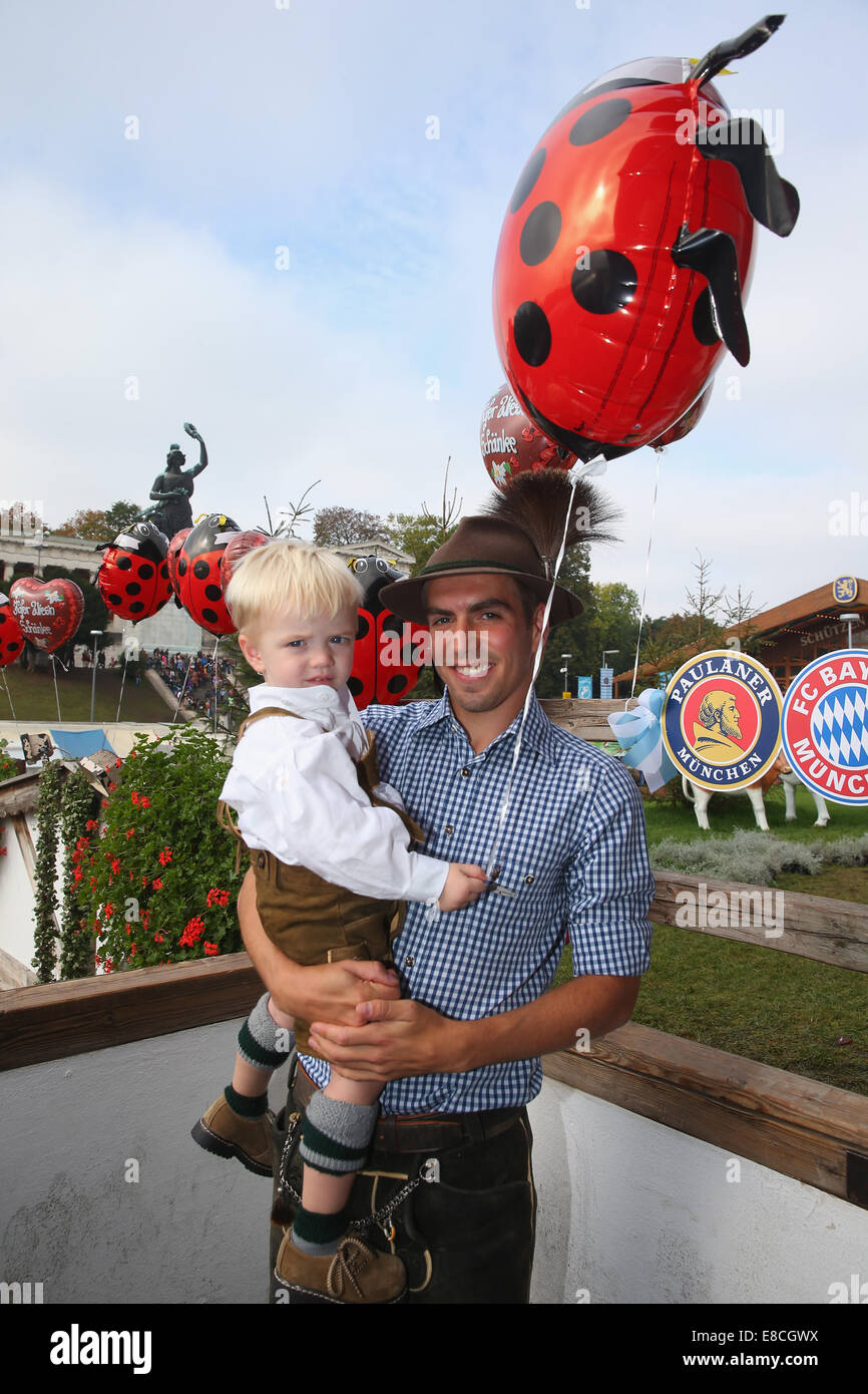 Munich, Germany. 5th Oct, 2014. Philipp Lahm attends with his son ...