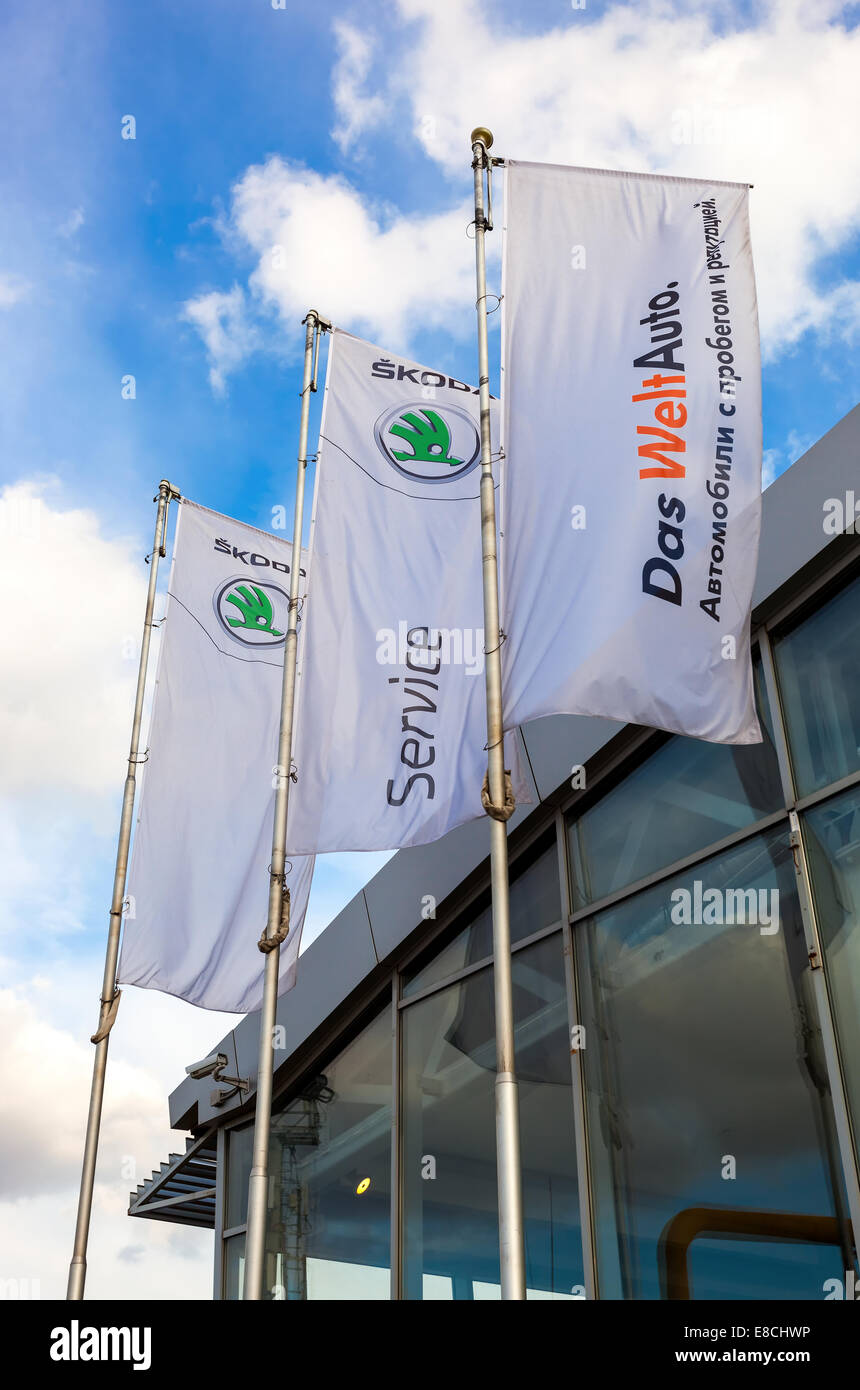 The flags of Skoda over blue sky. Skoda Auto more commonly known as ...