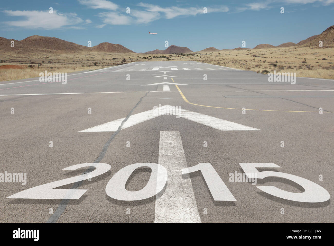Date numbers 2015 hovering on airport runway with direction markings ...