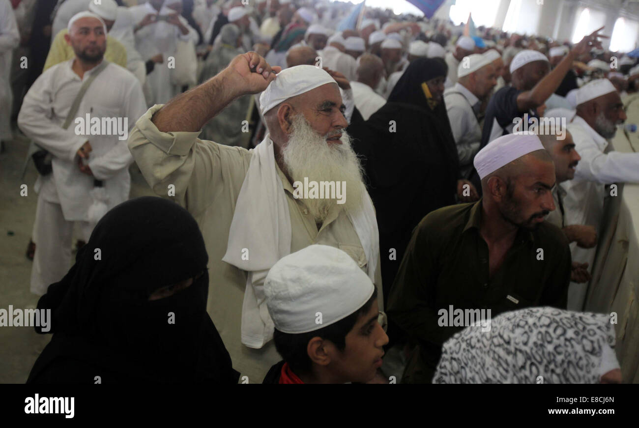 Mina, Mecca, Saudi Arabia. 5th Oct, 2014. Muslim pilgrims walk to cast ...