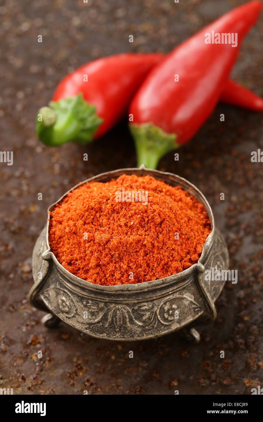 red spice paprika pepper on iron old background Stock Photo - Alamy