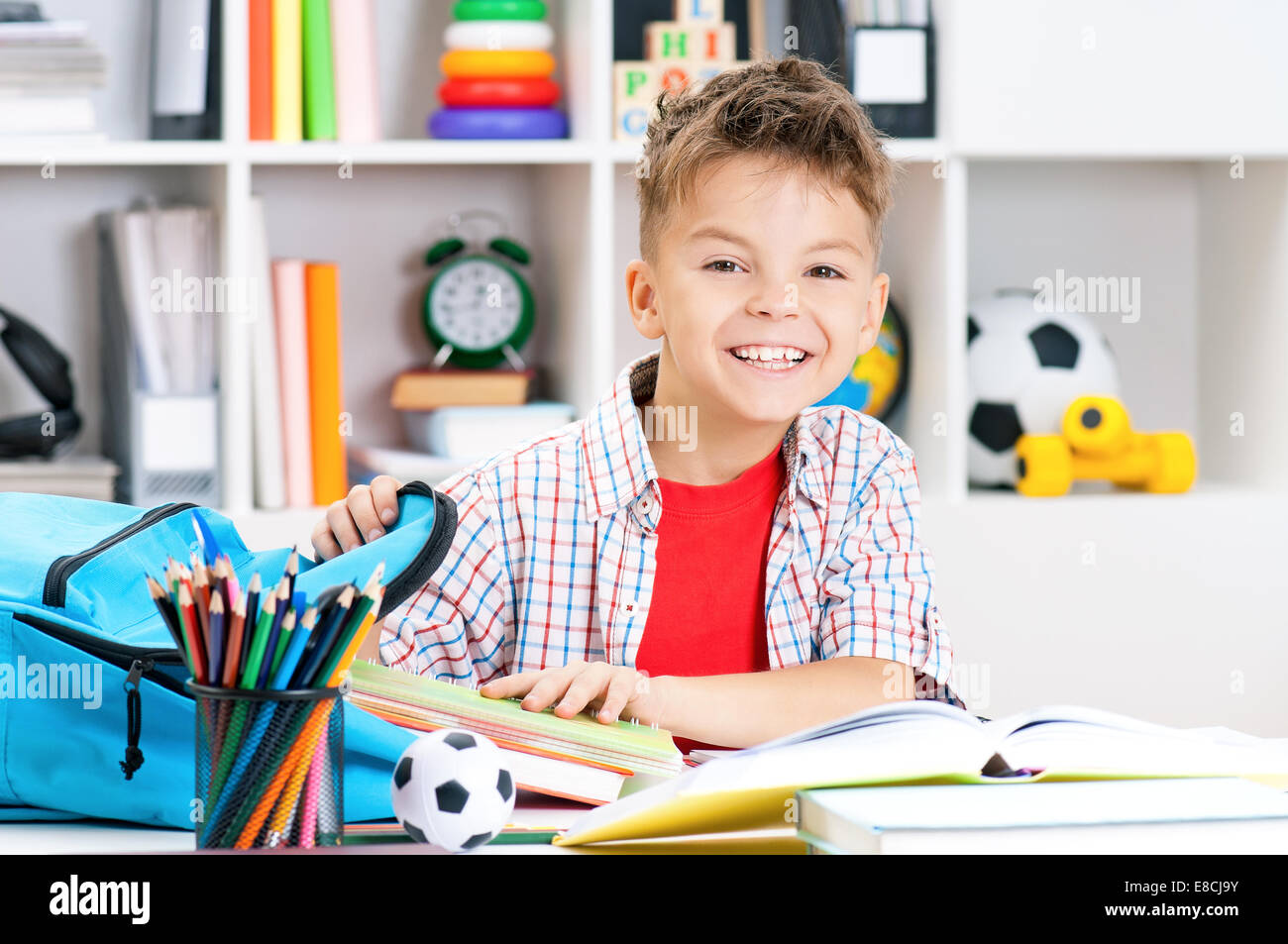 Boy doing homework Stock Photo - Alamy