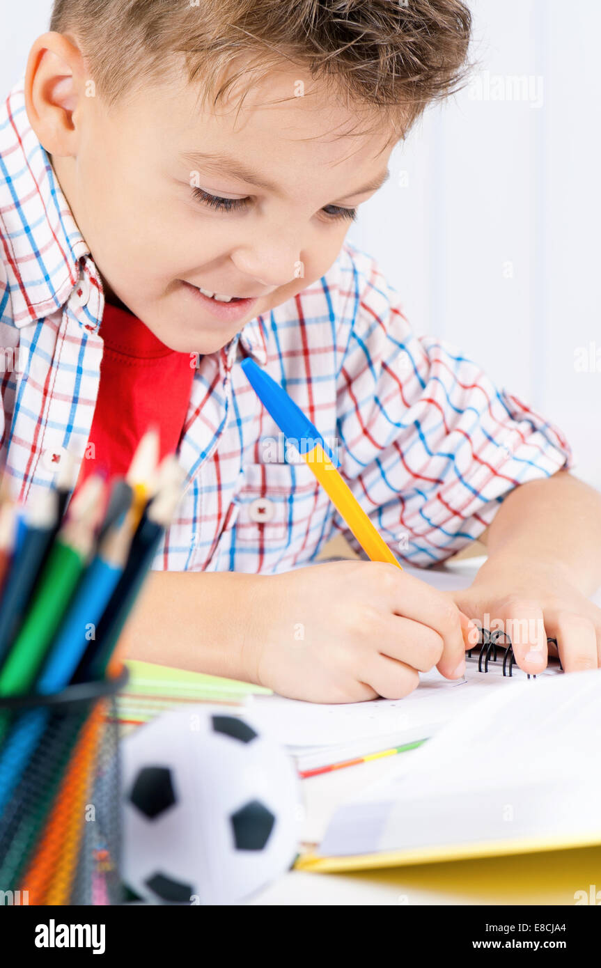 Boy doing homework Stock Photo - Alamy