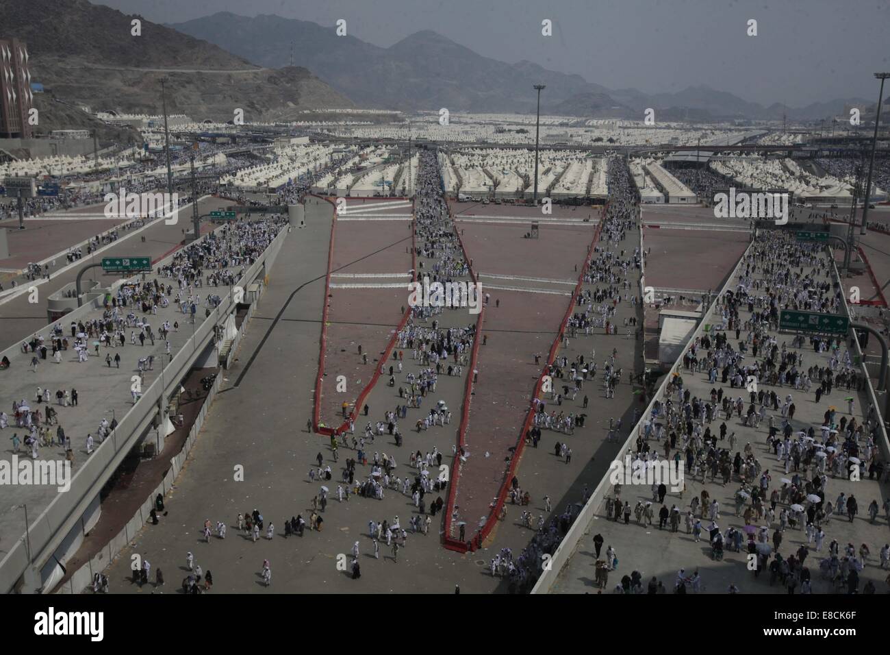 Mina, Mecca, Saudi Arabia. 5th Oct, 2014. Muslim pilgrims walk to cast ...