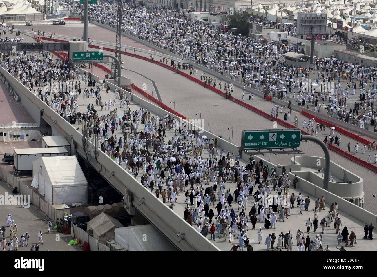 Mina, Mecca, Saudi Arabia. 5th Oct, 2014. Muslim pilgrims walk to cast ...