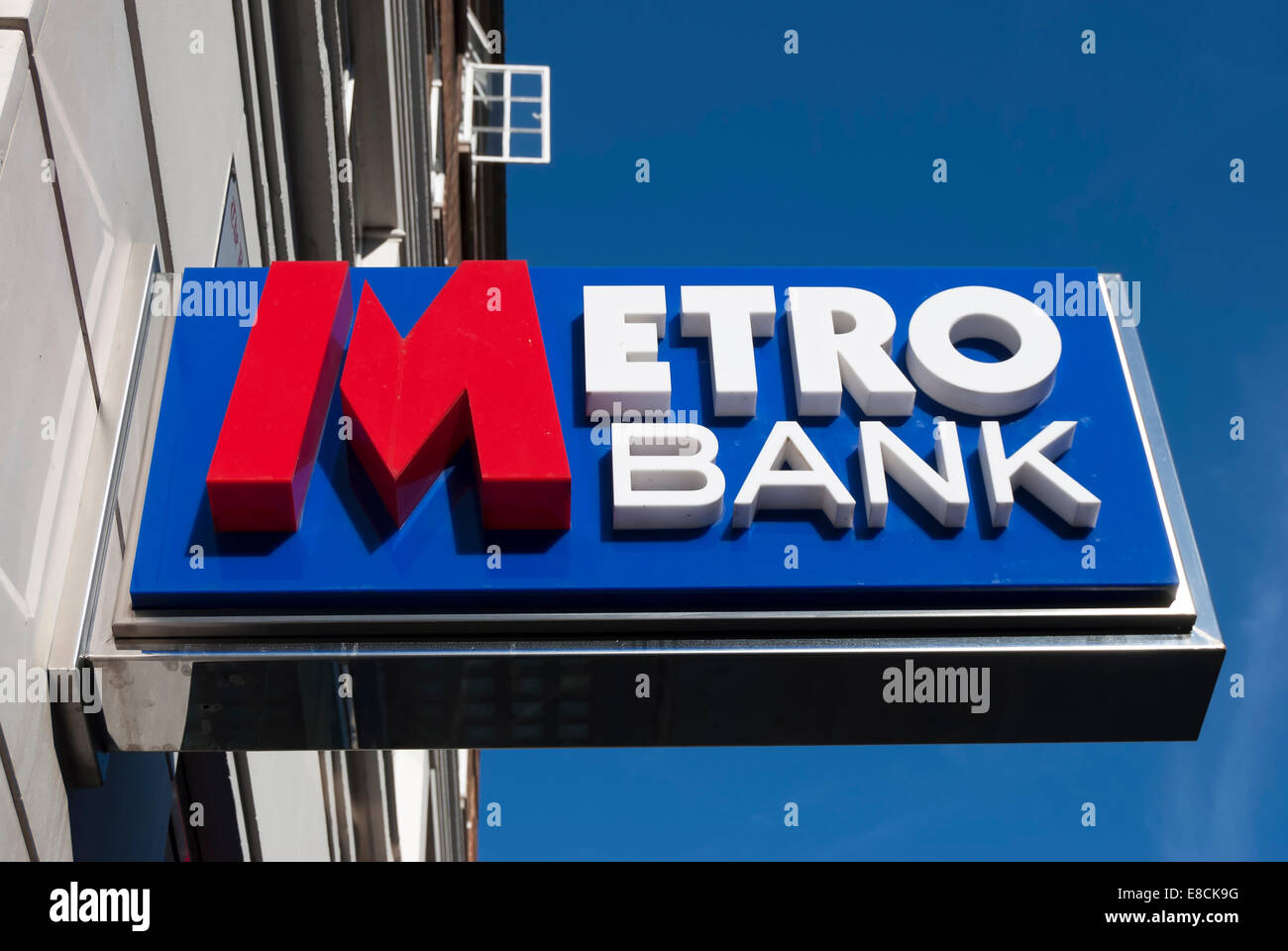 hanging sign for a branch of metro bank, kensington high street, london ...