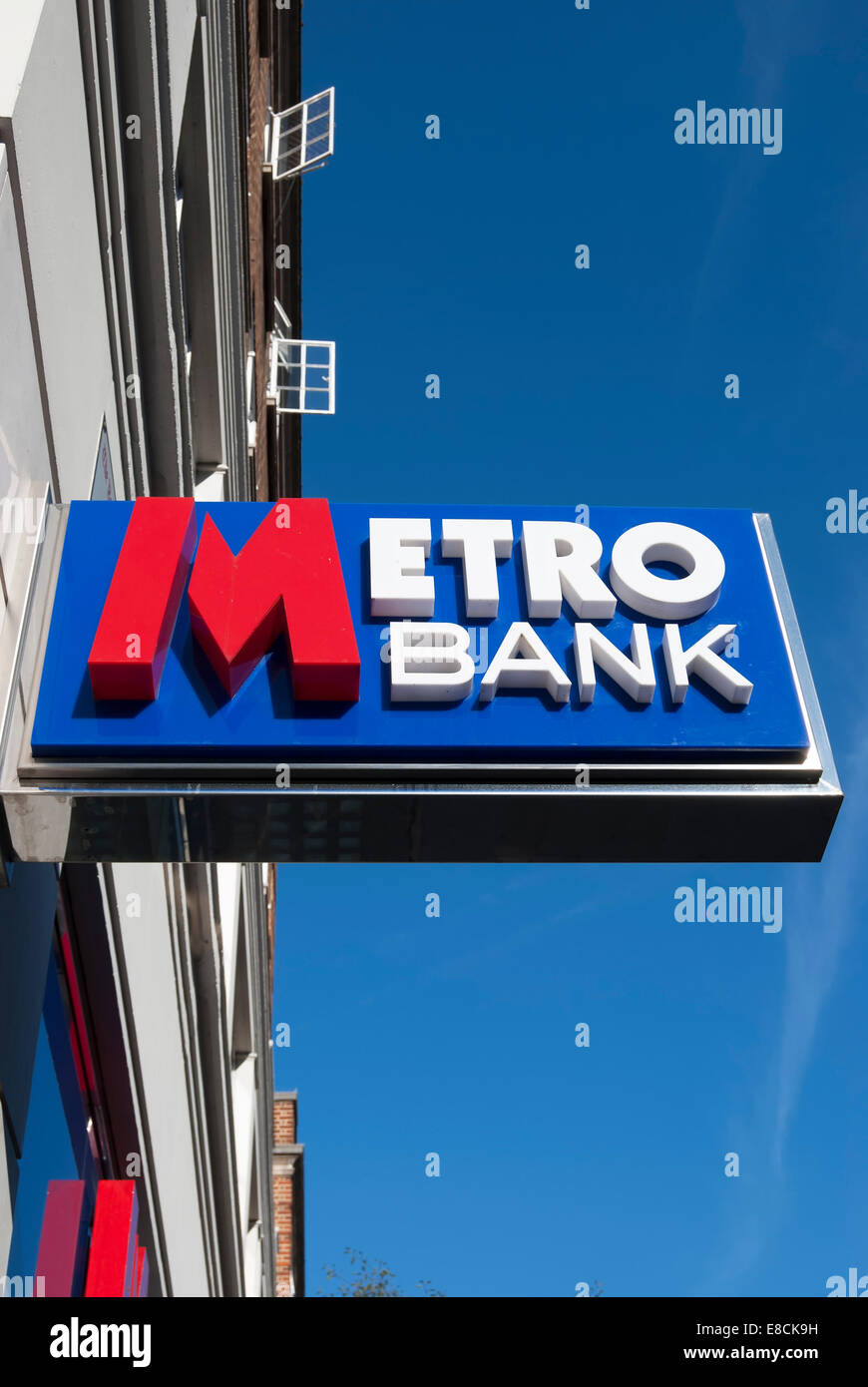 hanging sign for a branch of metro bank, kensington high street, london ...