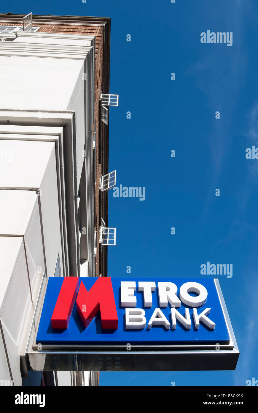 hanging sign for a branch of metro bank, kensington high street, london ...