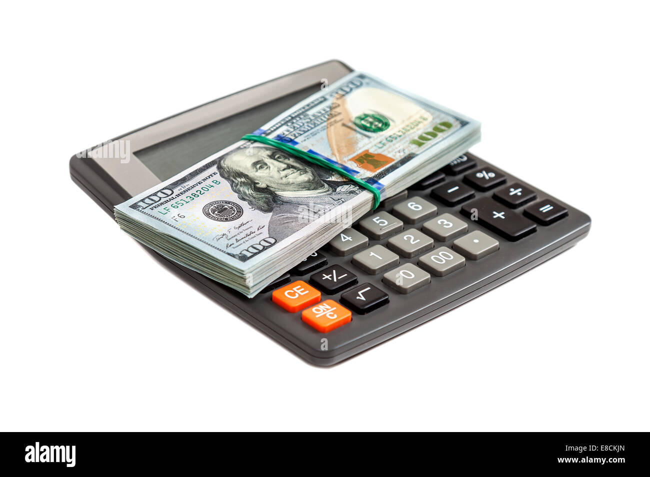 Calculator and dollars on the white background Stock Photo - Alamy