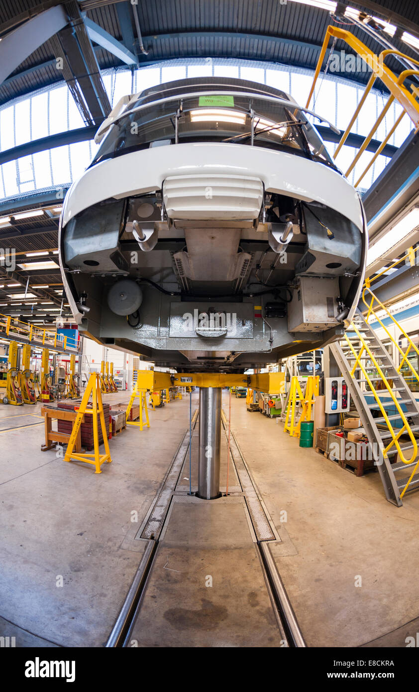 A Zurich Cobra tramway train lifted up on a giant lifting ramp during ...