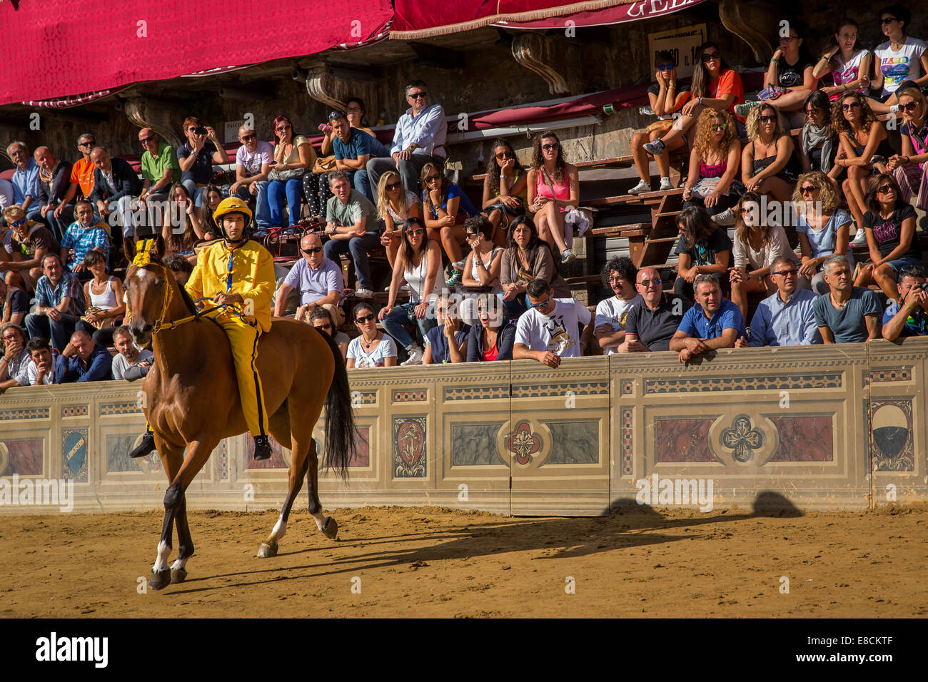 Jockey waiting for the start of Palio di Siena horse race on Piazza del ...
