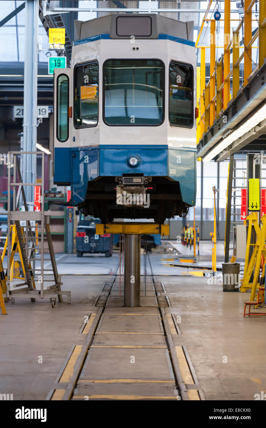 A Zurich tramway train lifted up on a giant lifting ramp during routine ...