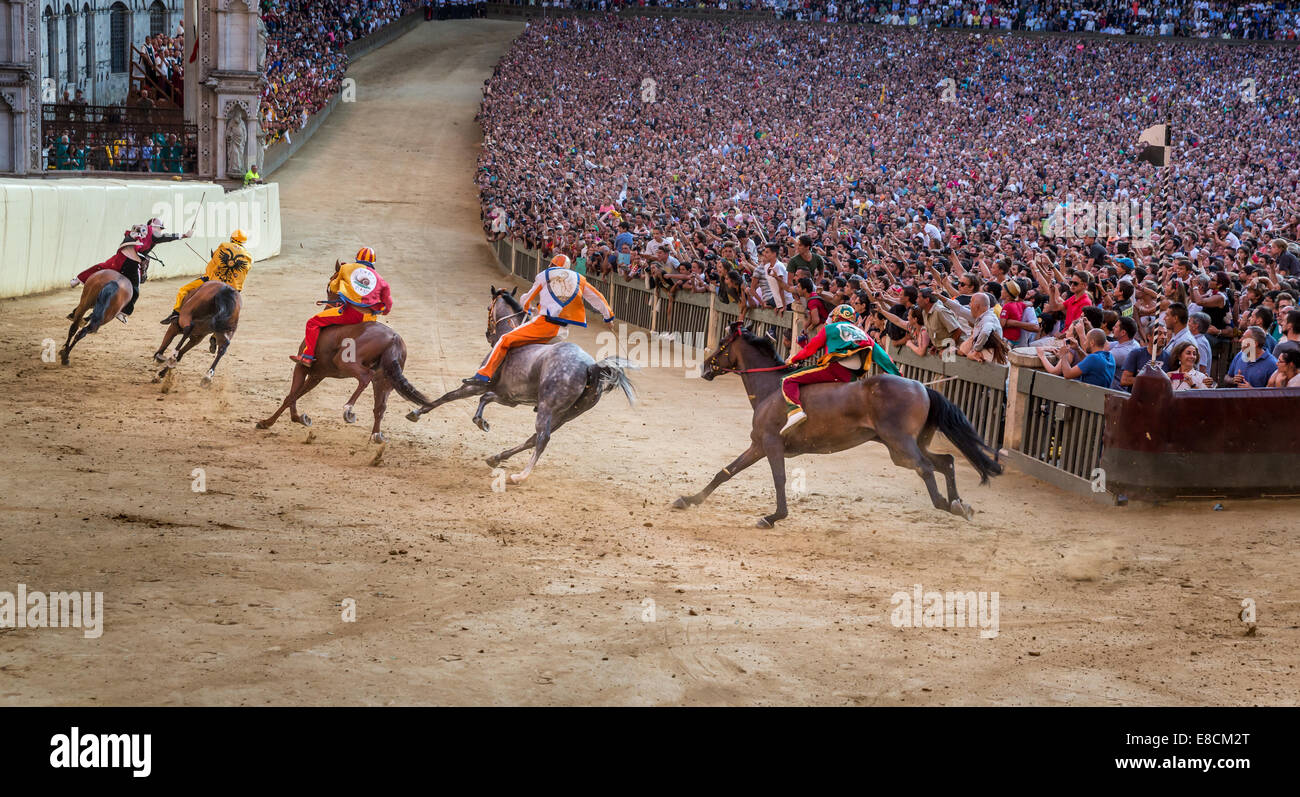 The Palio di Siena horse race on Piazza del Campo, Siena, Tuscany ...