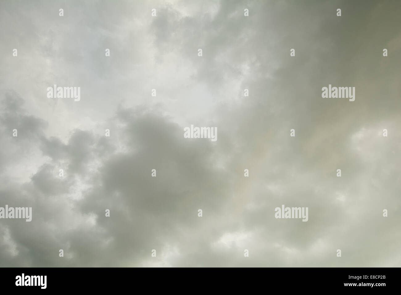 Grey moody sky with sunlight shining through clouds Stock Photo - Alamy