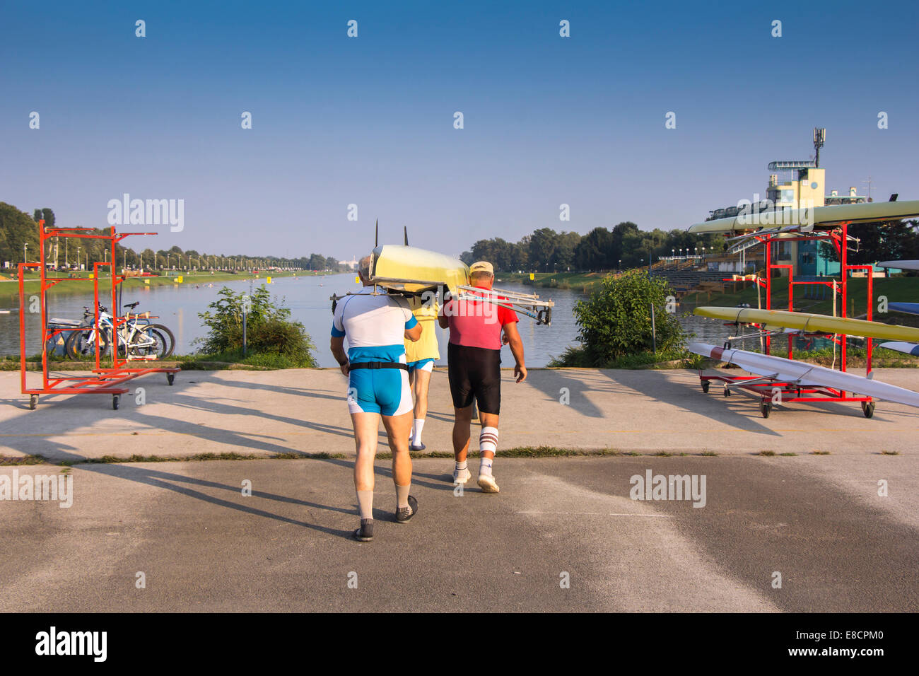 Four rowers wear ship at the starting point on the lake Stock Photo - Alamy