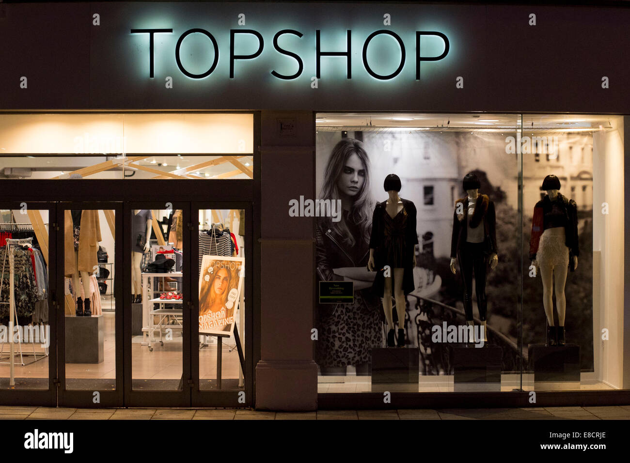A Topshop shop at night on the high street Stock Photo - Alamy
