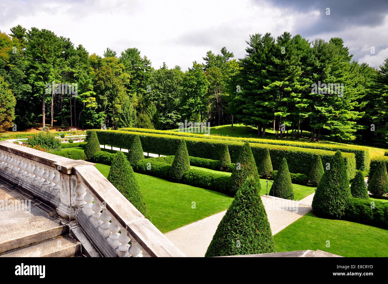 Lenox, Massachusetts: Trees clipped into cone shapes on the formal ...