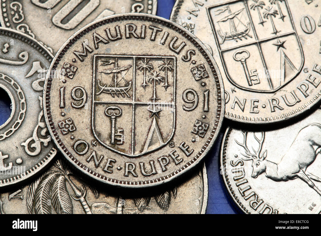 Coins of Mauritius. Mauritian national coat of arms depicted in the ...
