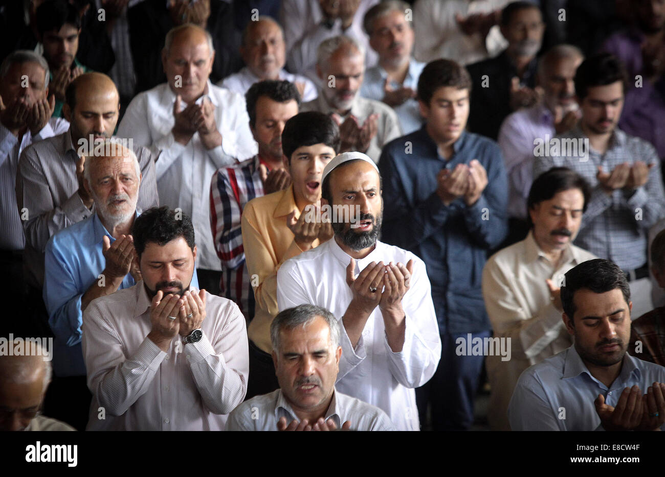Tehran, Iran. 5th Oct, 2014. Iranian Muslims pray during the Eid al ...