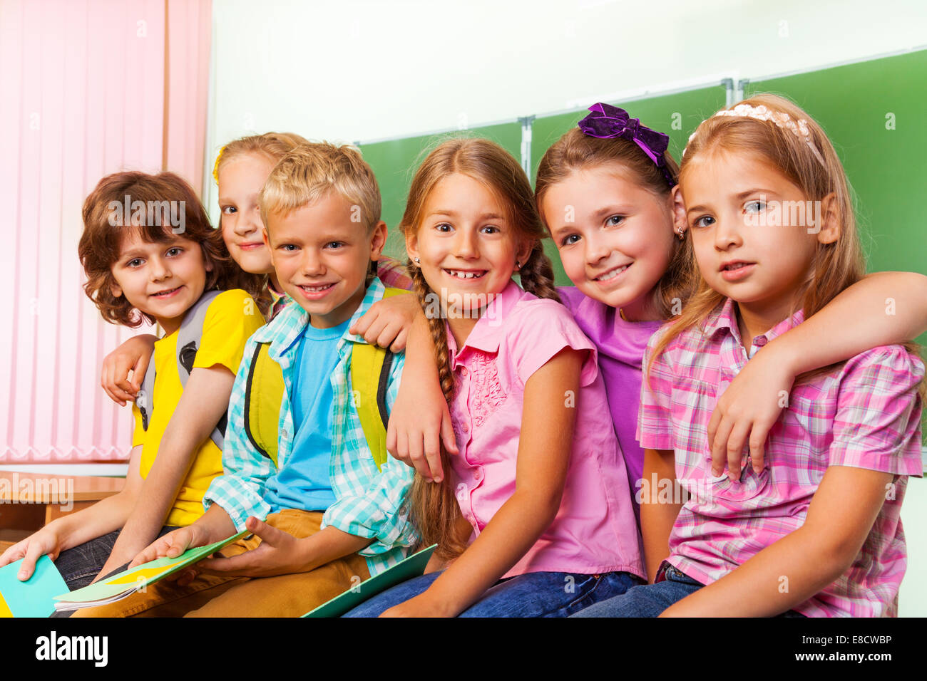 Children hug school hi-res stock photography and images - Alamy
