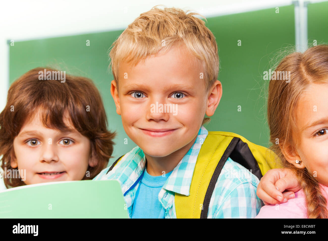 Children near each other in front of blackboard Stock Photo - Alamy