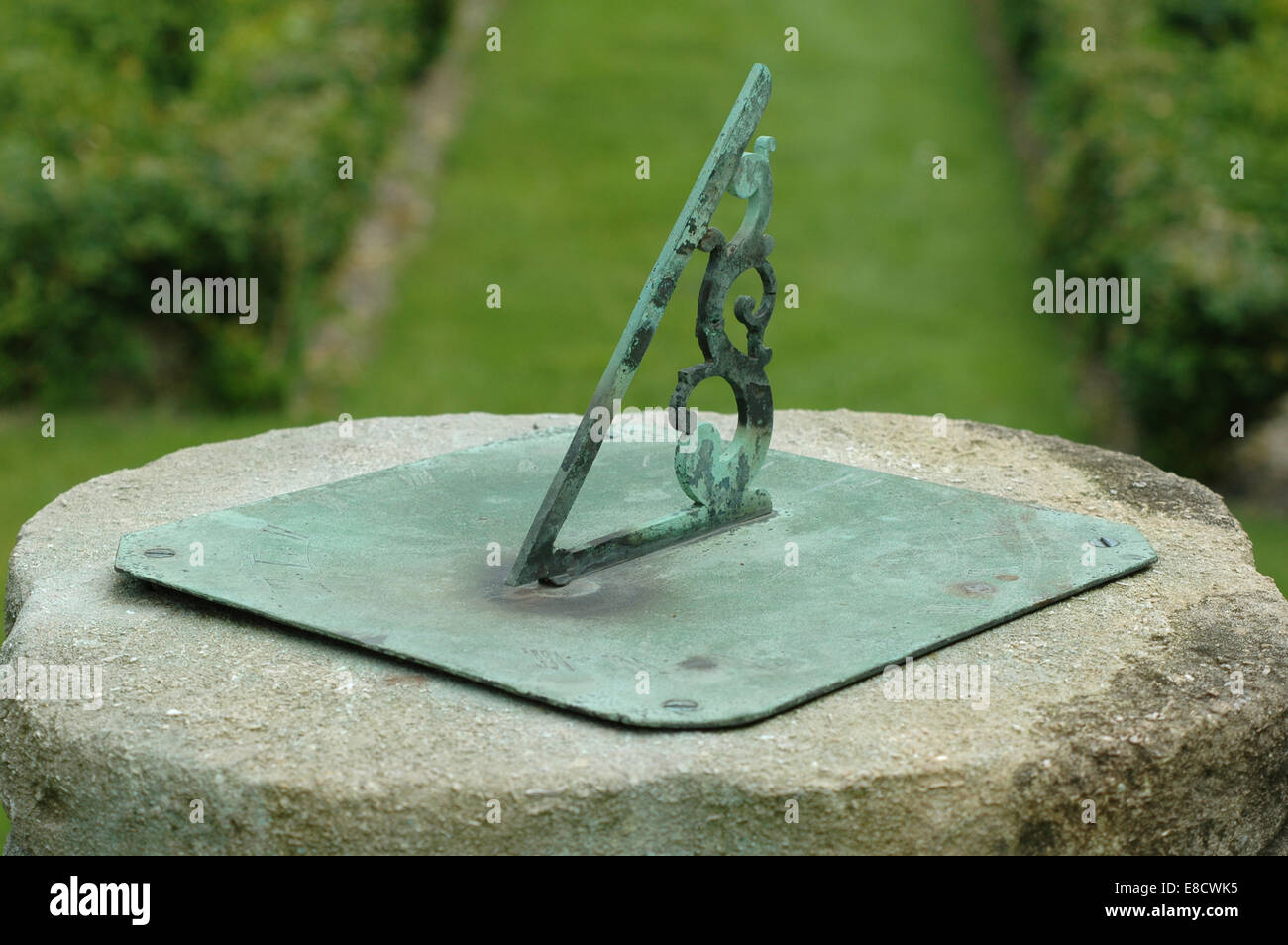 Green metal sundial Stock Photo - Alamy