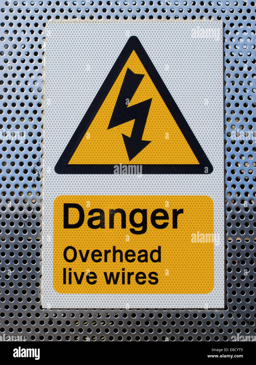 A sign showing danger overhead wires complete with a black on yellow ...