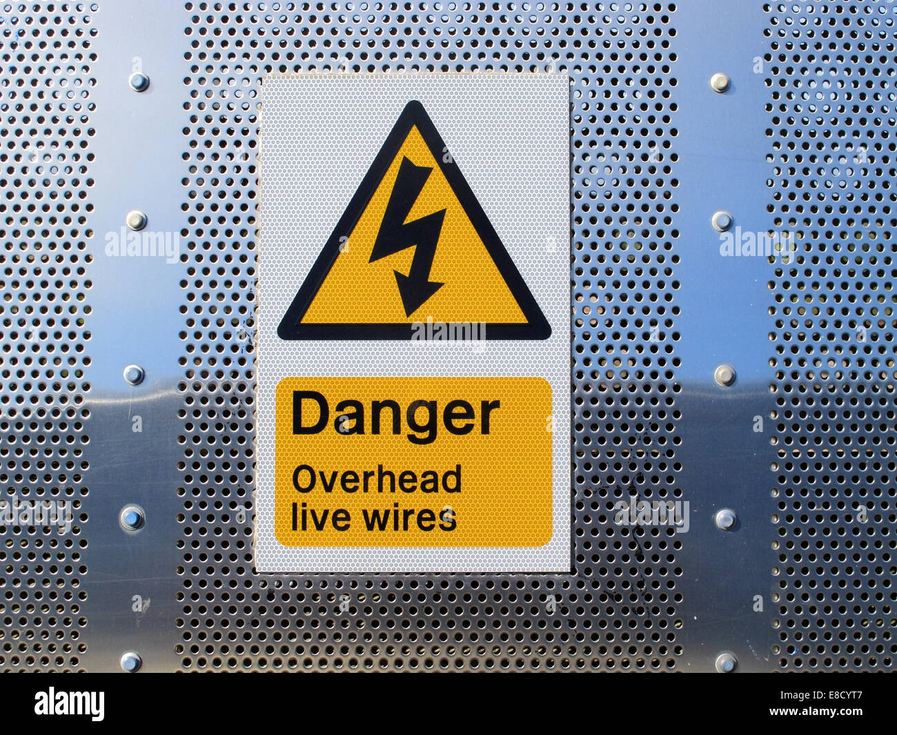 A sign showing danger overhead wires complete with a black on yellow ...