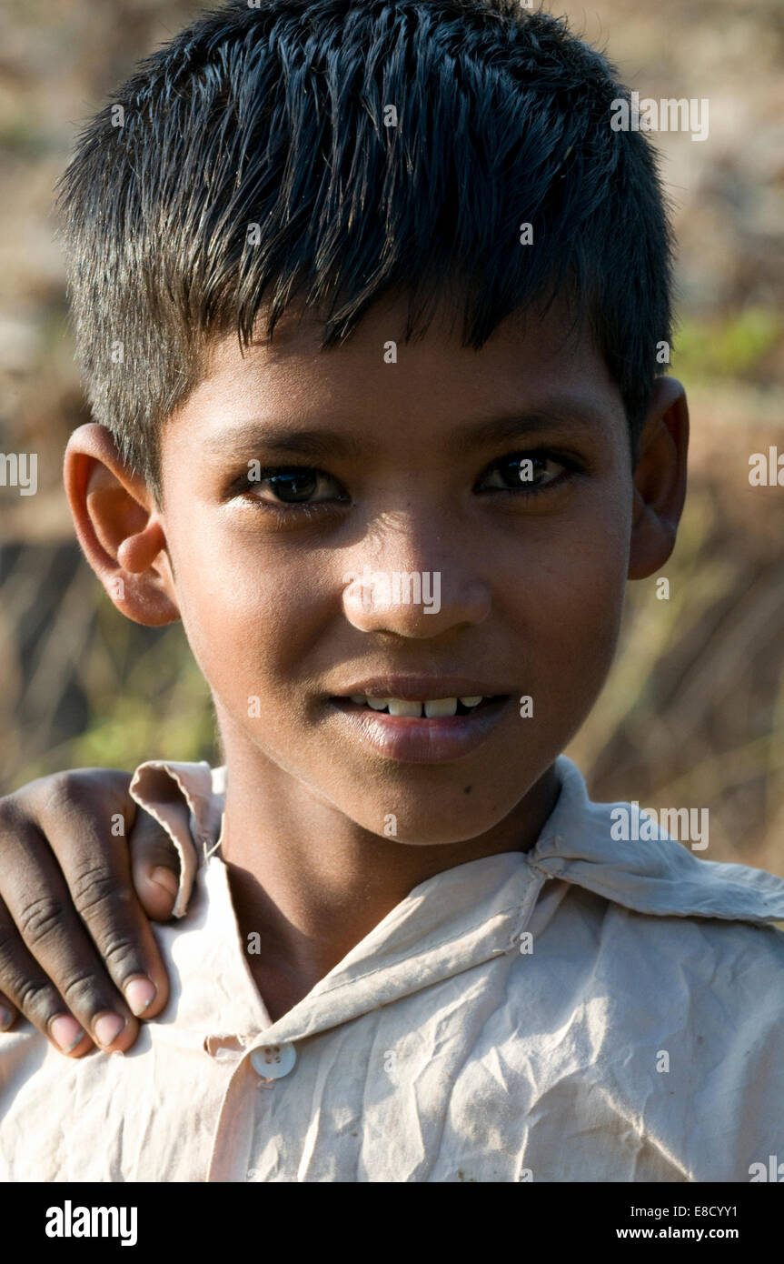 Young pure smiling Indian sunlit village boy Stock Photo - Alamy