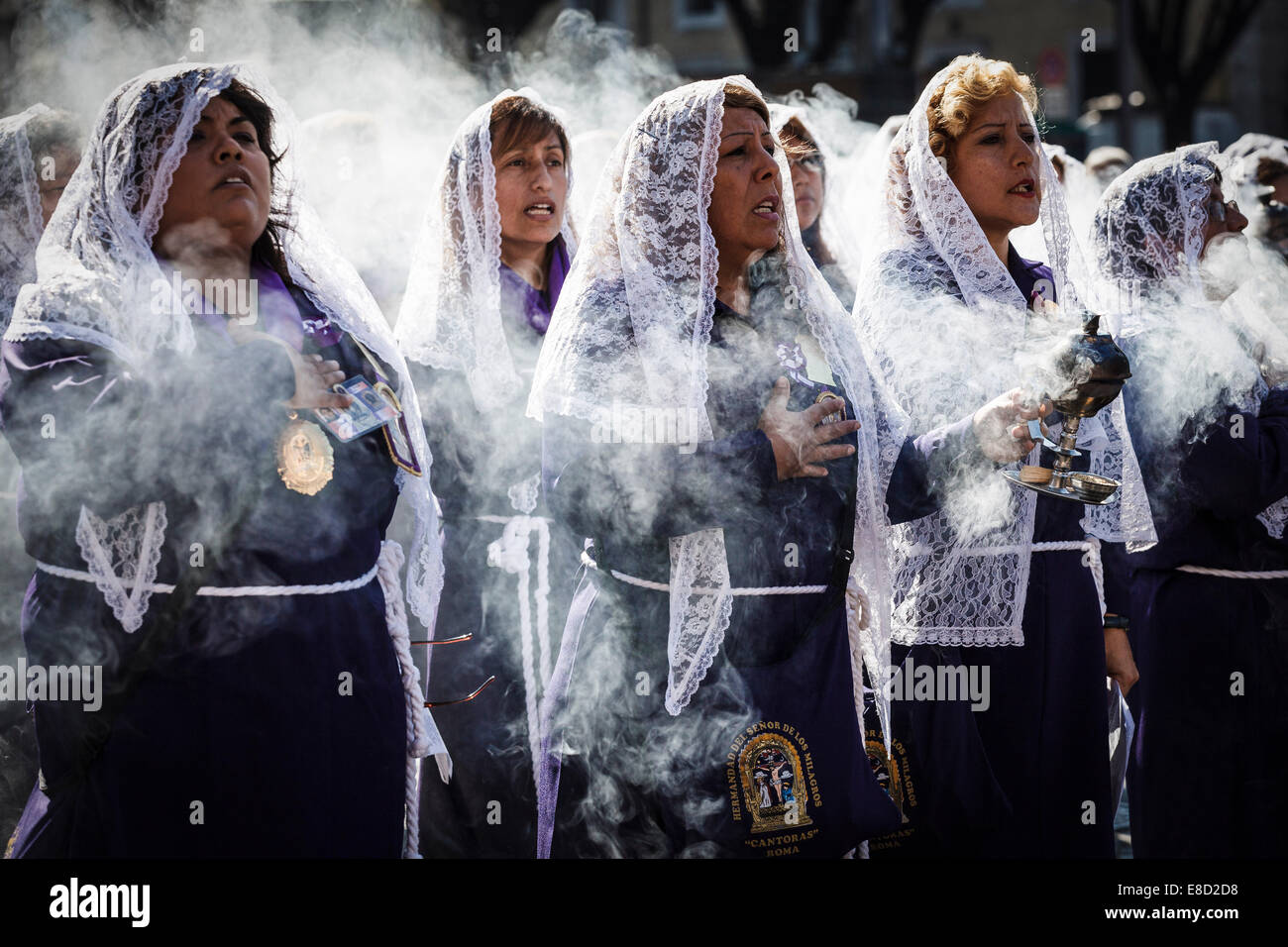 Peruvian women, known as "Sahumadoras", burn incense while ...