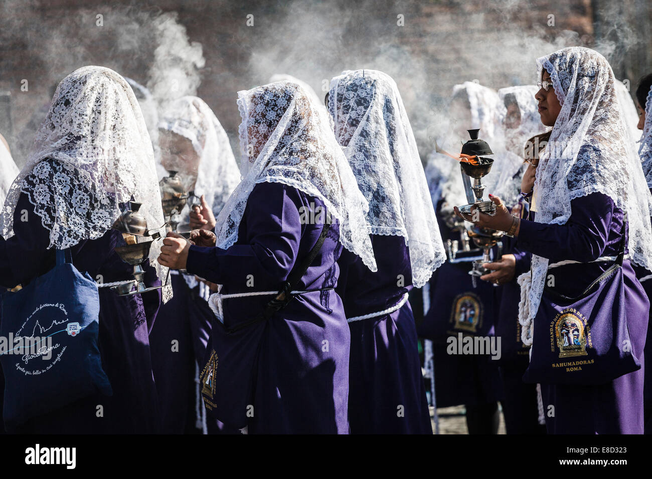 Peruvian women, known as "Sahumadoras", burn incense while ...