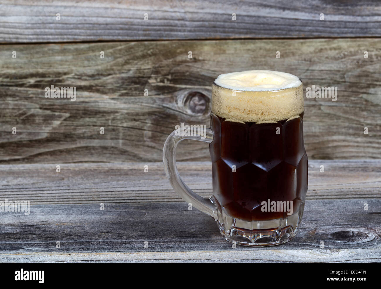 Horizontal image of a glass stein filled with dark draft stout beer on ...
