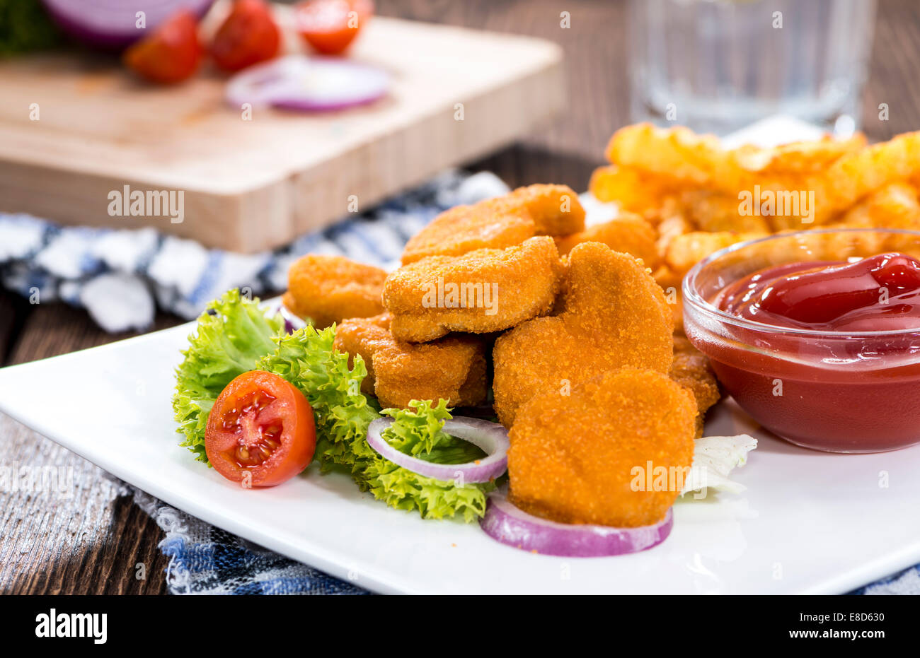 Some fresh made golden Chicken Nuggets with crispy chips Stock Photo ...