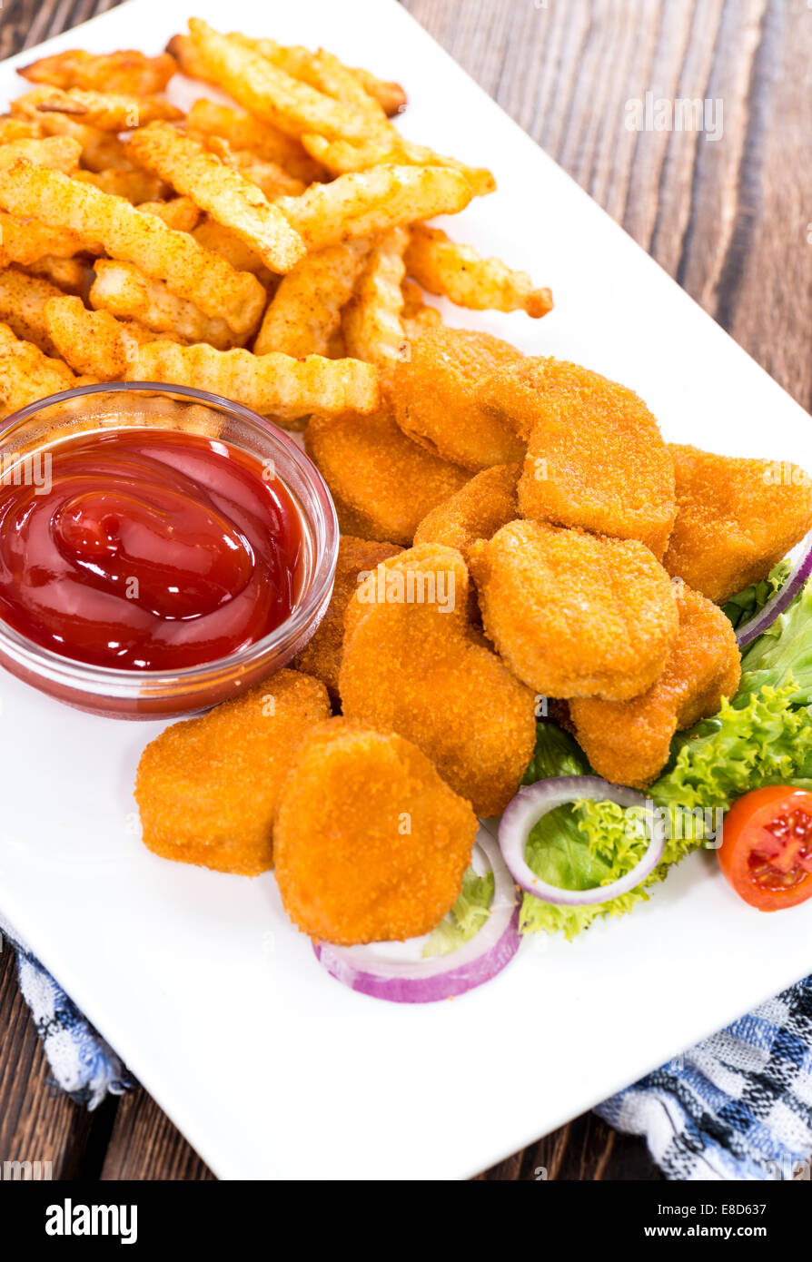 Some fresh made golden Chicken Nuggets with crispy chips Stock Photo ...