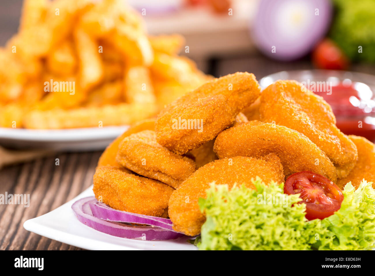 Some fresh made golden Chicken Nuggets with crispy chips Stock Photo ...